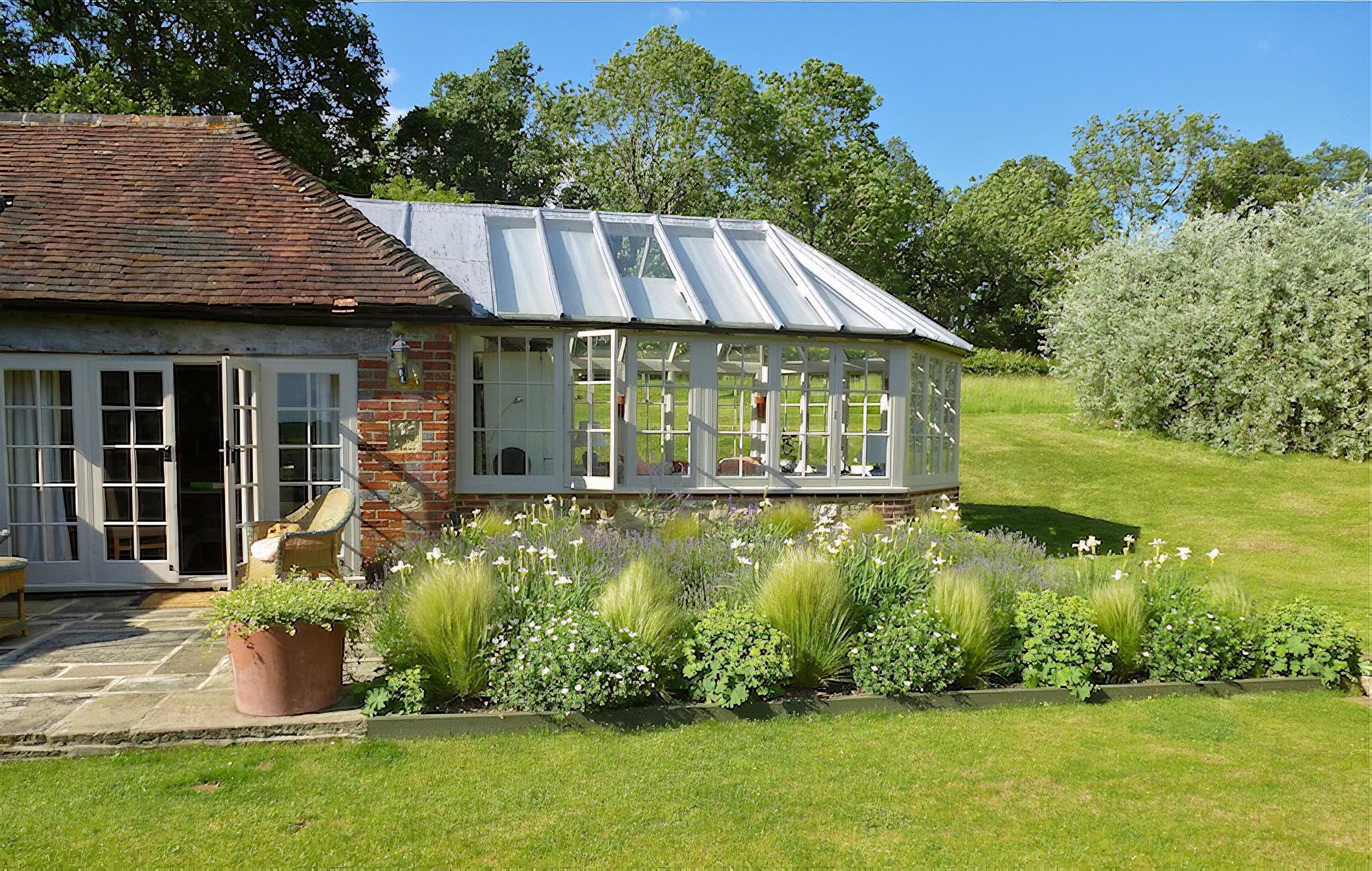 Converted farm courtyard garden by London garden designer Claudia de Yong